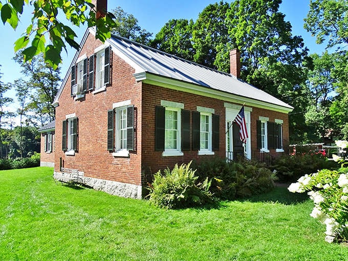 The History House Museum captures Skowhegan's past in a perfectly preserved brick home, where American flags and hydrangeas frame doorways to earlier times.