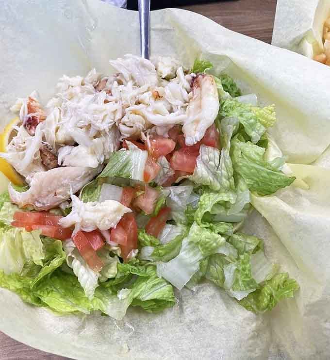 Fresh crab meat crowning crisp lettuce like edible confetti, turning a simple salad into a celebration worth photographing.