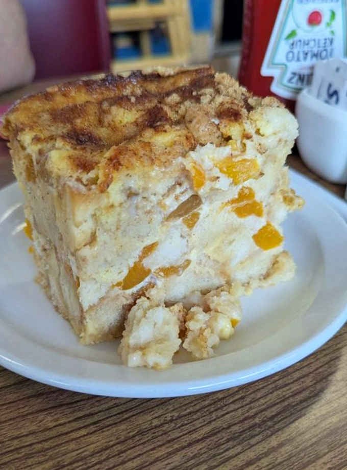 Peach bread pudding this tall should come with a warning label and possibly its own zip code.