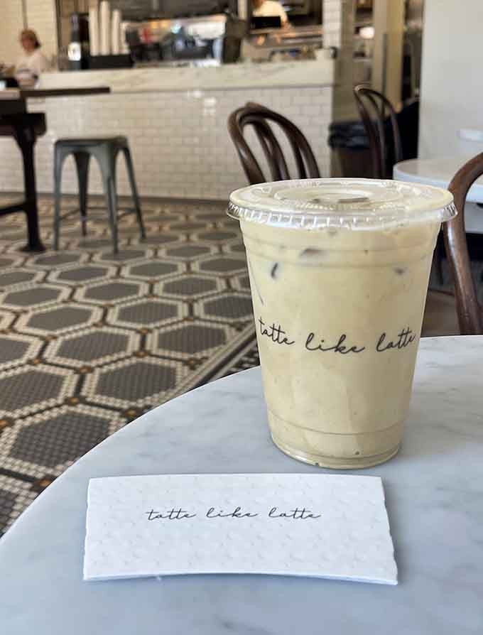 Iced coffee with a side of charming branding reminds you that presentation matters, even for your caffeine fix.