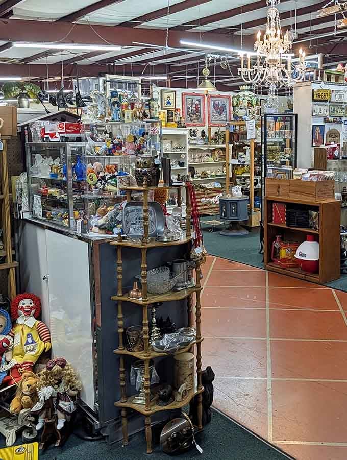 Crystal chandeliers dangle above the aisles because even antique shopping deserves proper ambiance and a touch of unexpected glamour throughout.