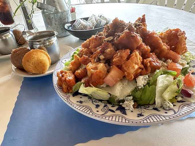 Crispy buffalo chicken perched atop fresh greens, proving salads can be exciting when you try hard enough.