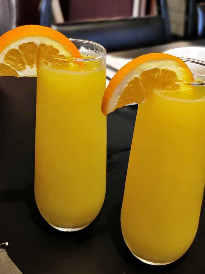 Fresh-squeezed mimosas that prove brunch without bubbles is just a sad, late breakfast with delusions of grandeur.