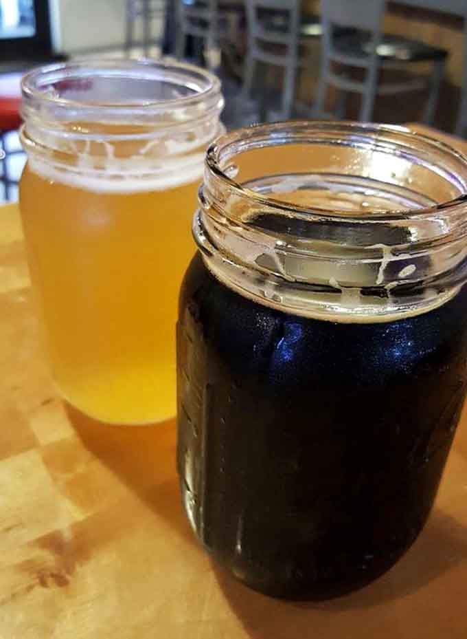 Mason jars filled with craft brews, because fancy glassware is overrated when the beer tastes this good.