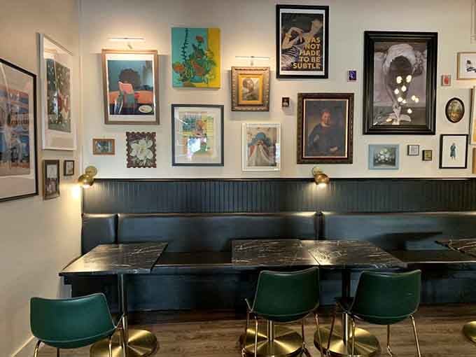 Gallery wall seating with velvet chairs creates Instagram-worthy spots that are actually comfortable enough to read in for hours.