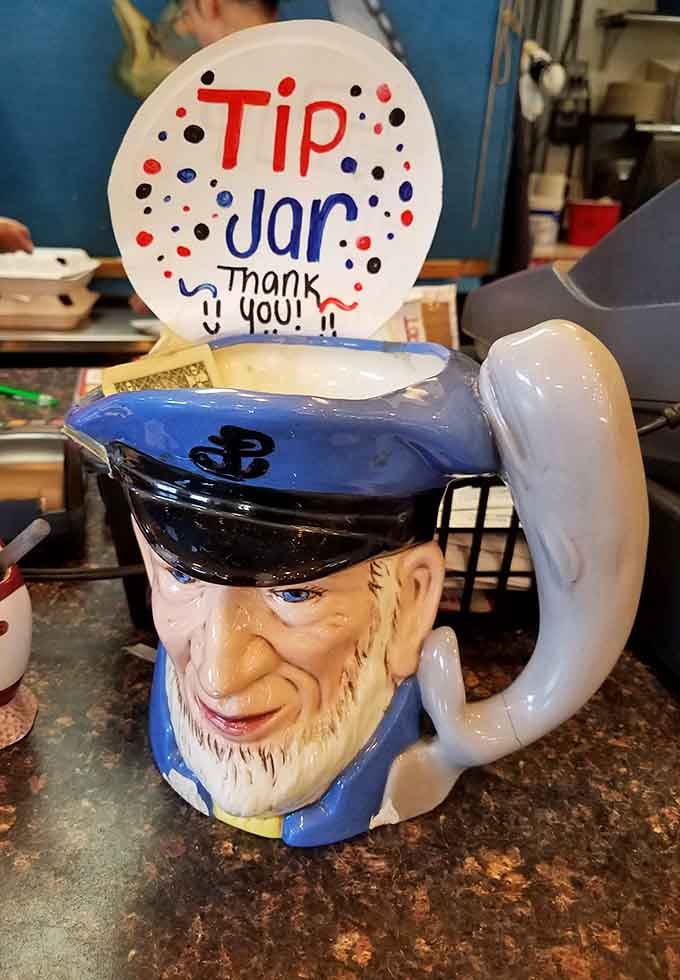 Even the tip jar has personality here, perched atop a cheerful sailor mug that's seen many satisfied customers.
