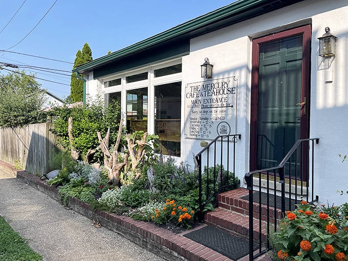 The Mercury Cafe and Teahouse welcomes visitors with cottage garden charm. Even the flowers seem to be saying, "Come in for a scone!"