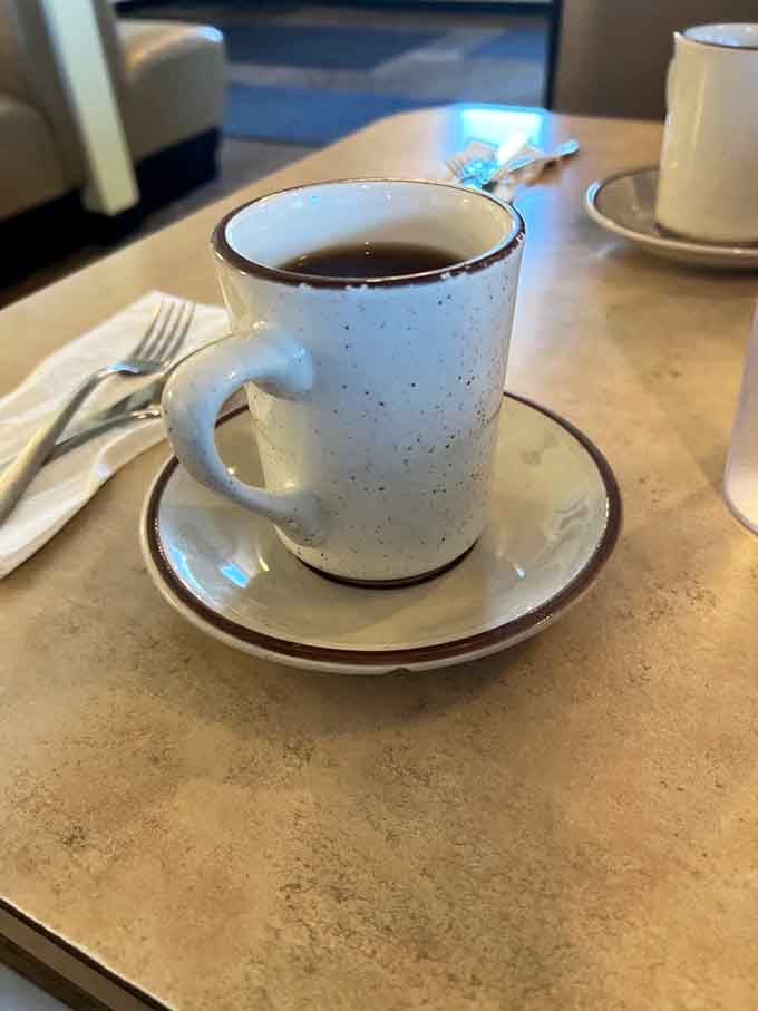 That speckled mug holds liquid motivation, refilled with a smile before you even ask.