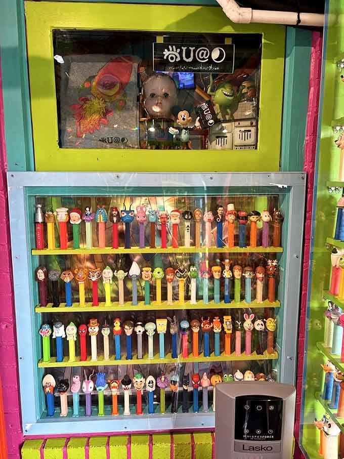 An entire wall of PEZ dispensers watches you eat, which is either delightful or mildly unsettling.