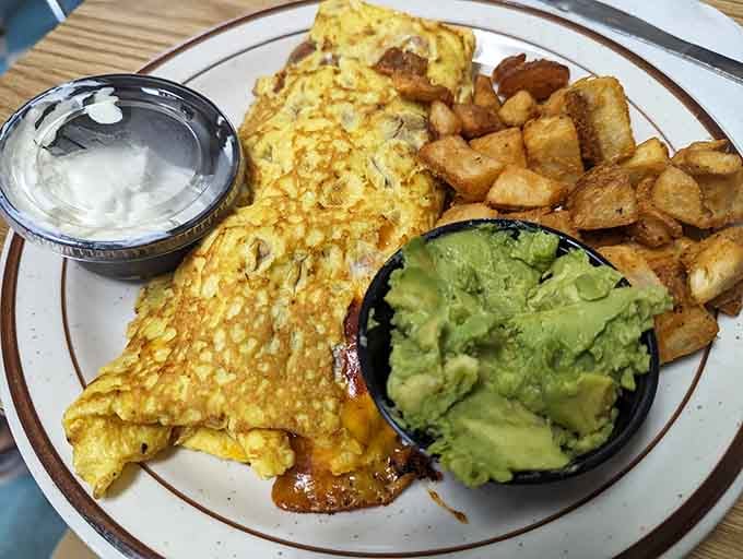 Golden omelet perfection paired with home fries, because breakfast should always feel like a warm hug from your grandmother.
