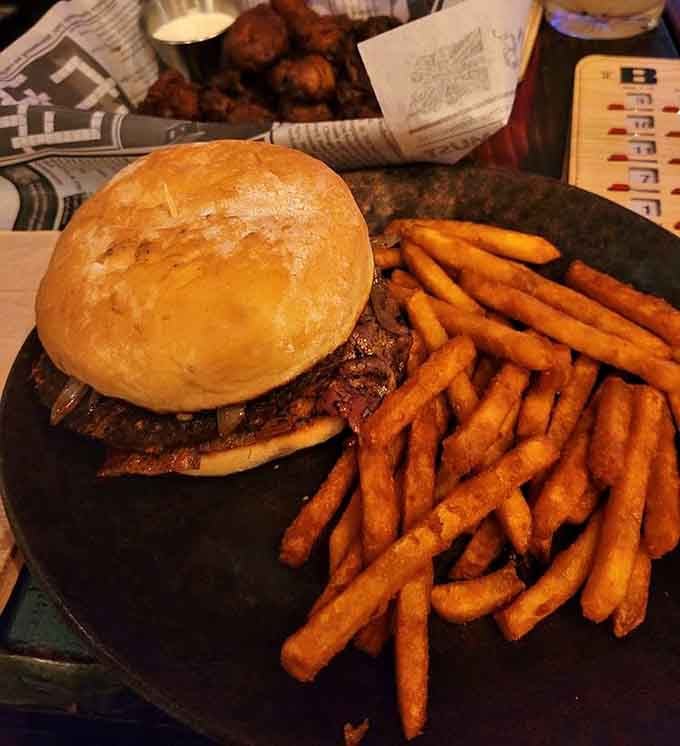 This burger and fries combo at The Sparrow & Serpent satisfies cravings with classic pub fare done right.