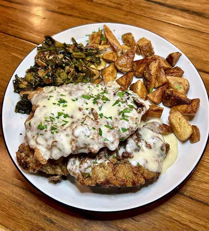 Breaded chicken smothered in creamy sauce with Brussels sprouts proves vegetables can absolutely belong on your plate.