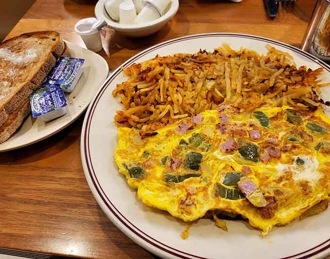 This omelet comes loaded with peppers, bacon, and enough cheese to make your cardiologist schedule a meeting.