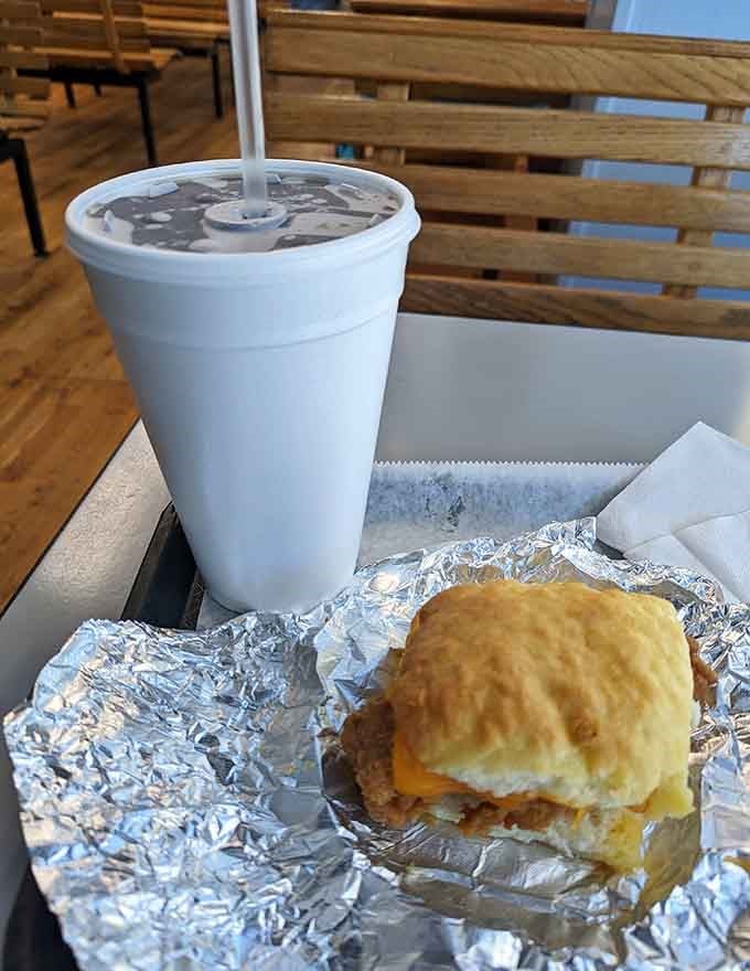 Behold the golden-topped masterpiece that's launched a thousand cravings, perfectly paired with an ice-cold drink for maximum satisfaction.