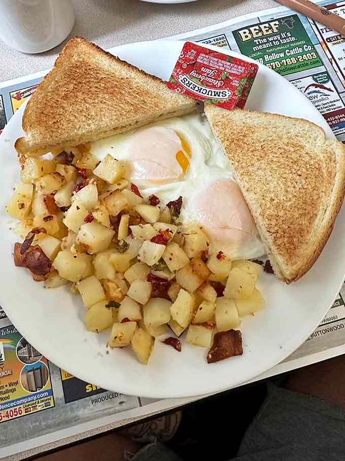 Eggs cooked just right with home fries that actually earned the "home" part of their name: breakfast perfection.