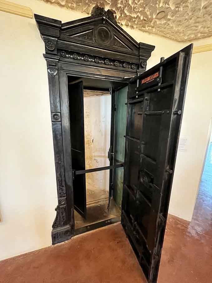 Yes, that's an actual bank vault door, because apparently someone took home security very, very seriously here.