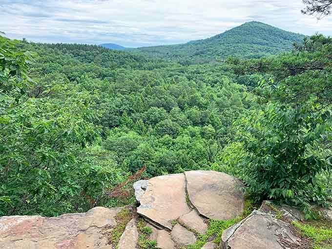 Mountain vistas stretch endlessly from the overlook, rewarding those who tackled the uphill climb with spectacular views.