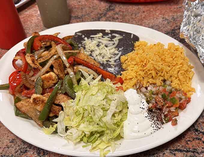 Sizzling chicken fajitas with rice and beans prove this place takes its Latin cuisine seriously, any time.