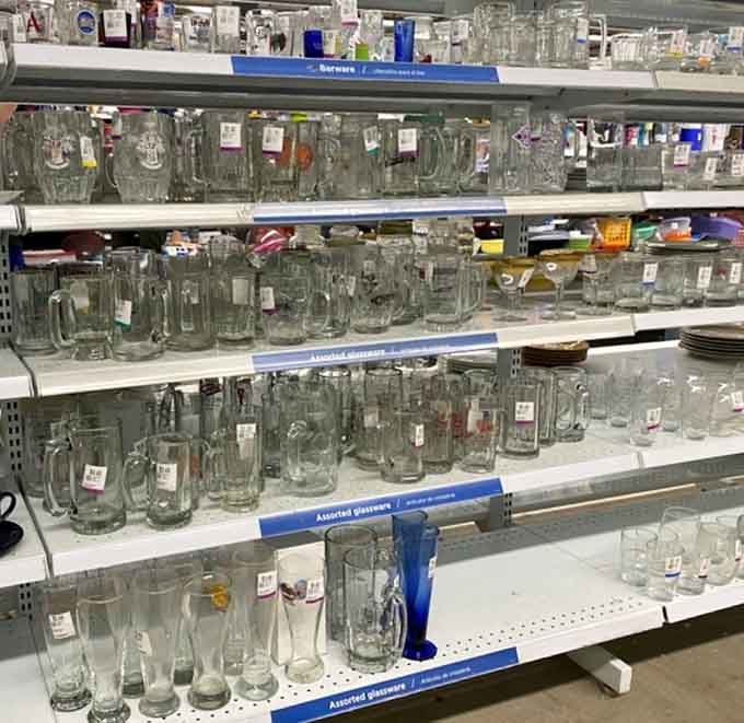 Beer steins and glassware standing at attention, ready to host your next gathering without requiring a second mortgage.