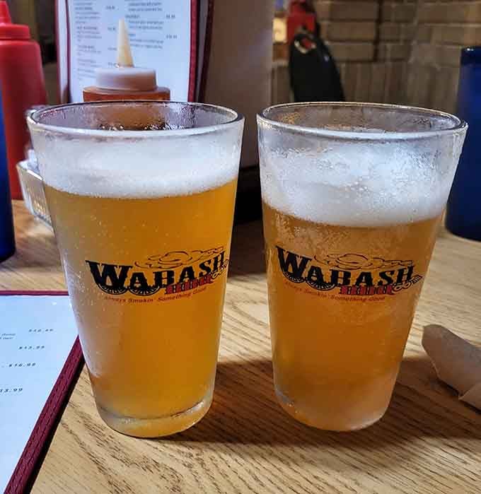 Cold beer in branded glasses pairs beautifully with smoked meats and the satisfaction of discovering something special.