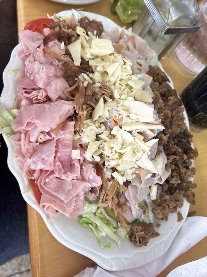 The house salad proves even the sides here get serious attention and generous portions of everything good.