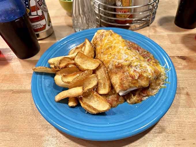This burrito smothered in chili verde and cheese proves that wrapping breakfast in a tortilla was humanity's smartest culinary decision.