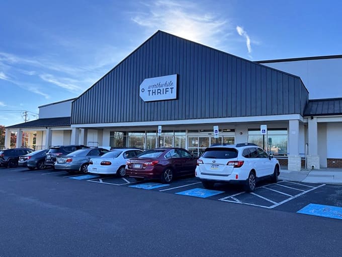 Even at dusk, the parking lot stays busy because serious thrifters know the best finds don't keep regular hours.