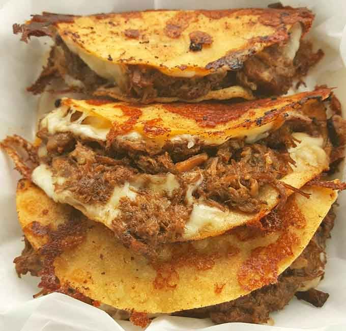 These aren't just tacos; they're edible love letters to Texas-Mexican fusion, with crispy edges that crackle with each blissful bite.