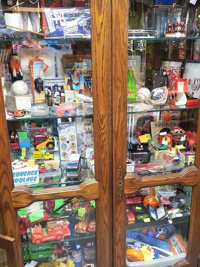 Behind glass doors, childhood memories stand at attention&mdash;toys that entertained generations before screens became our collective babysitter.