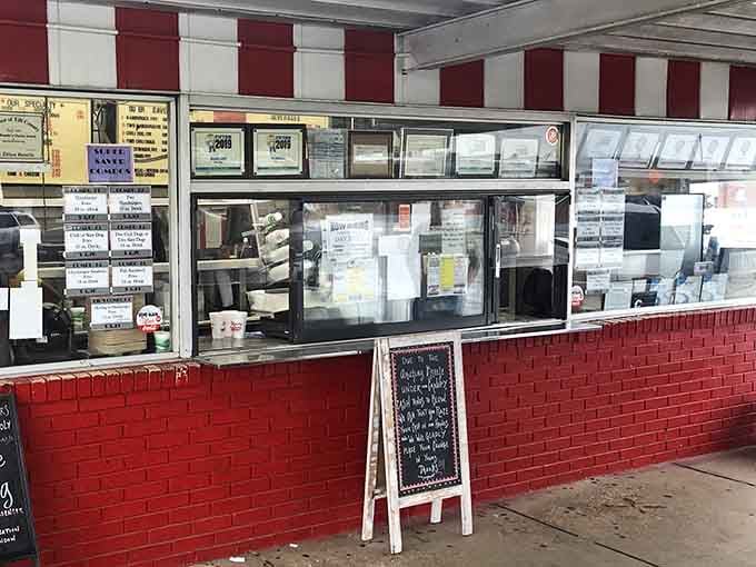 The ordering window: where dreams come true and diets go to die. Red brick, handwritten specials, and the promise of something wonderful just moments away.