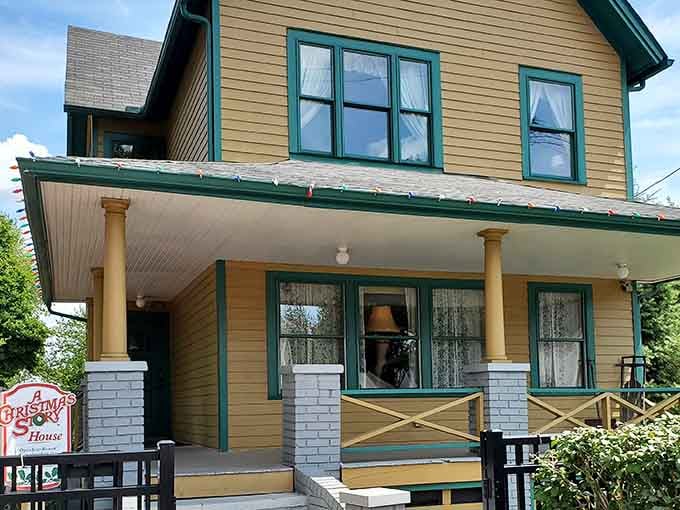 The famous house stands ready for visitors, its yellow paint and green trim exactly matching every movie fan's memory.