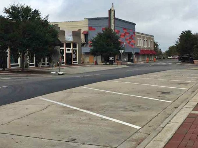 That vintage theater marquee reaches skyward, a monument to when downtown was the only entertainment anyone needed.