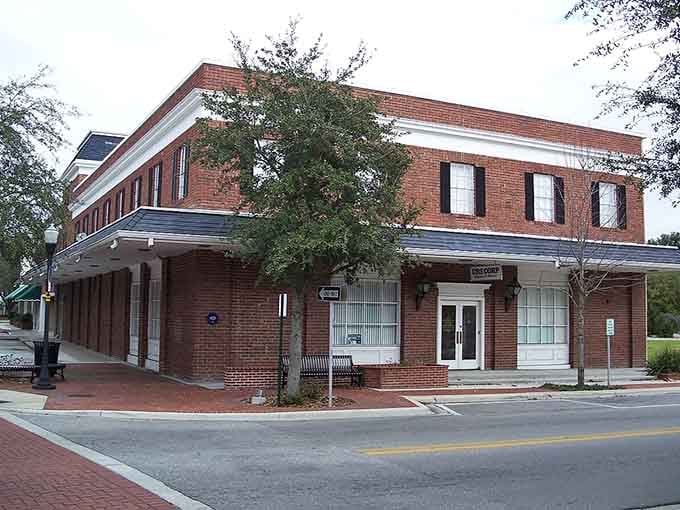 Sturdy brick storefronts and a wraparound porch-like awning give this downtown corner an easygoing, nostalgic charm.