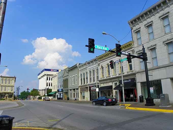 Main Street curves gently into the distance, where every storefront represents a dream that didn't require venture capital funding.