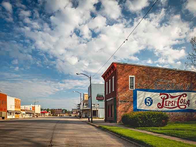 That vintage Pepsi sign and classic storefronts create a scene that would make Norman Rockwell reach for his paintbrush immediately.