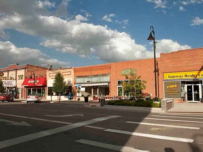 Warm brick facades glow under gathering clouds in a downtown where storm-level rent increases don't exist.