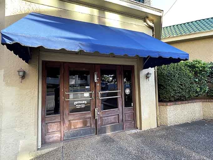 Cotham's blue awning signals salvation for the seriously hungry. Behind those doors, burgers the size of hubcaps await their next victims.