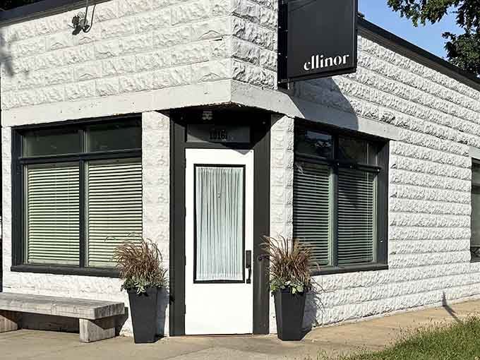 The sleek white brick and modern black trim signal sophisticated dining experiences packed into this tiny corner space.