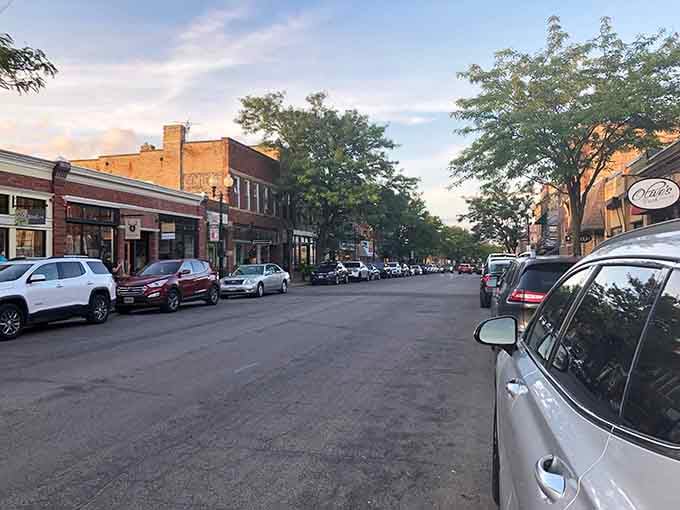 The main street stretches ahead, lined with charming shops and a calm, inviting atmosphere.