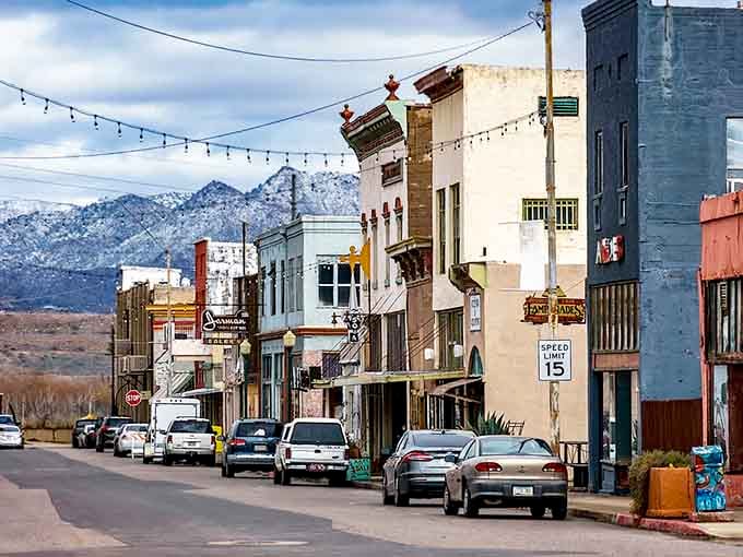 Snow-dusted peaks tower over historic buildings where speed limits stay low and life moves at a gentler pace.