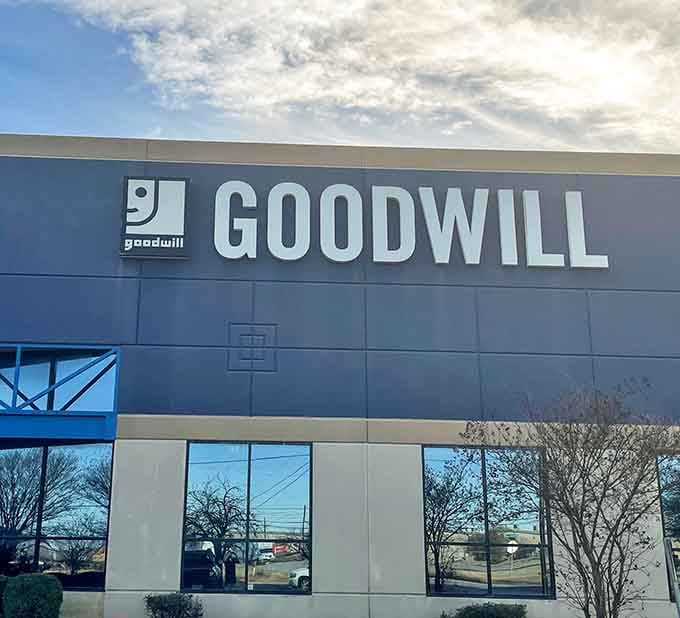 That massive blue Goodwill sign towers overhead like a beacon guiding smart shoppers toward unbeatable deals and hidden gems.