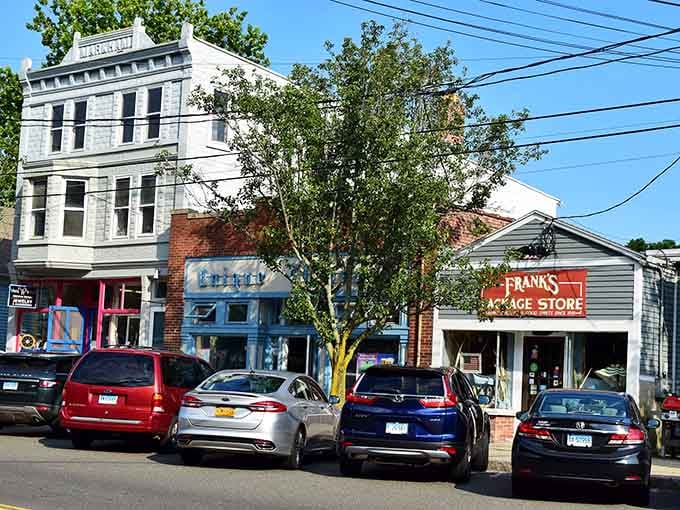 Classic storefronts line up like old friends reuniting, each building telling stories through weathered brick and vintage signs.