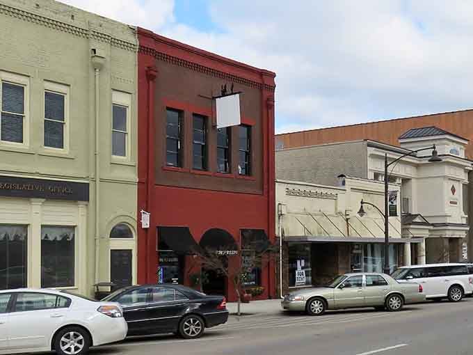 Colorful facades bring character to main street where local businesses thrive in beautifully restored historic buildings.