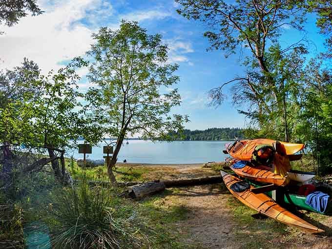 Colorful kayaks lined up on the beach promise adventures that'll make your fitness tracker think you've gone crazy.