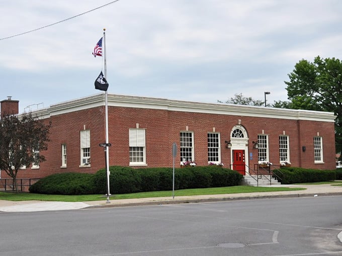 Clean brick lines and white trim create classic American architecture that never goes out of style or breaks the bank.