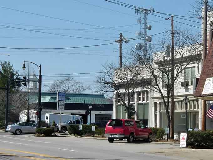 The morning light hits these shops just right, illuminating a main street where small businesses still thrive affordably.