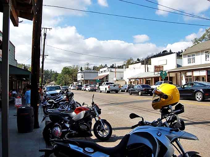 Julian's main street welcomes motorcycle enthusiasts exploring the mountain town. The bright yellow helmet adds a pop of color to this charming scene.