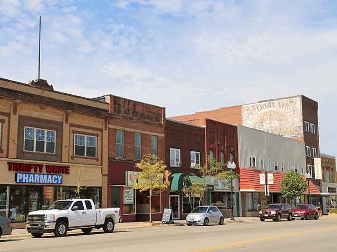 Faded ghost signs on brick walls tell stories of businesses past, adding layers of history to every downtown stroll.