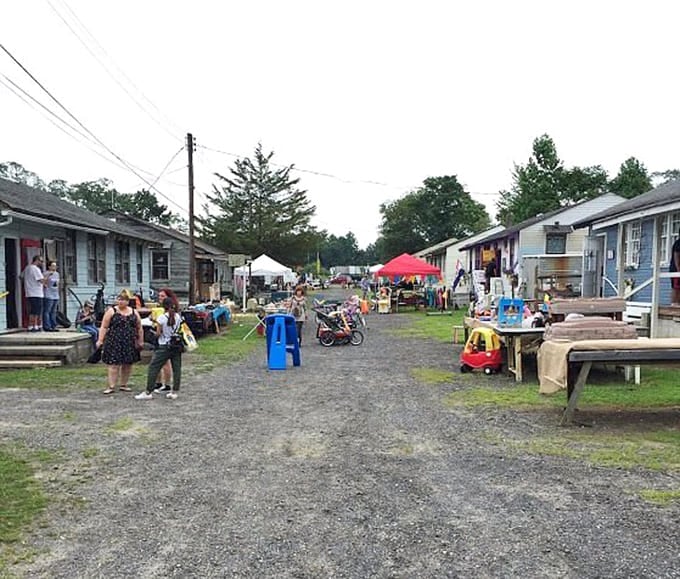 Charming cottage-style buildings create a village atmosphere where browsing feels more like visiting neighbors than shopping at stores.