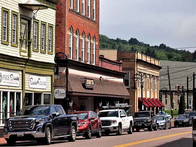 Mountain storefronts nestle against hillsides where local businesses serve communities that remember when everyone knew everyone.